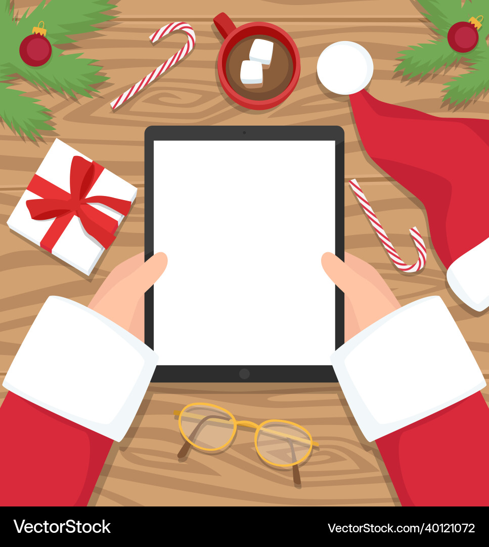 Santa holding tablet on his wooden table Vector Image