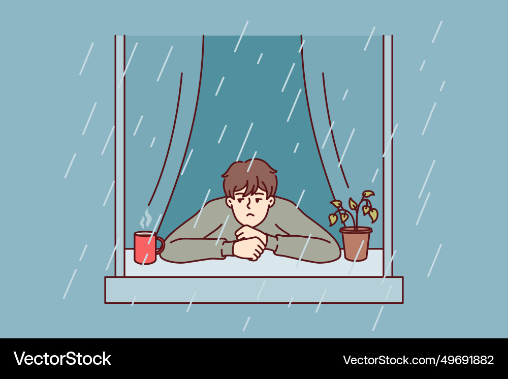 Melancholic man looks at rain from window Vector Image