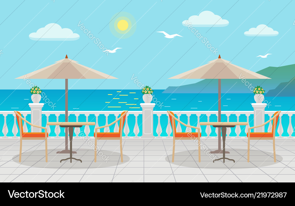 Cafe with tables under umbrellas with sea views on
