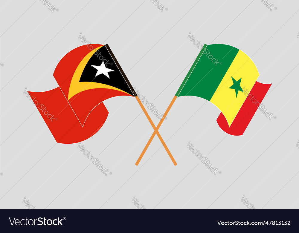 Crossed and waving flags of east timor and senegal