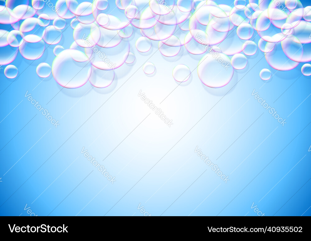 Soap bubbles abstract blue background with rainbow