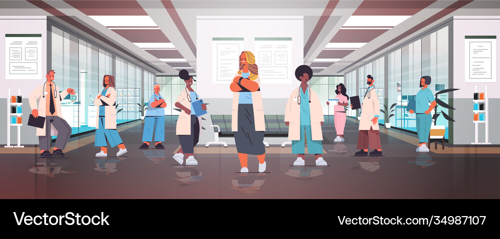 Team mix race doctors in uniform standing Vector Image