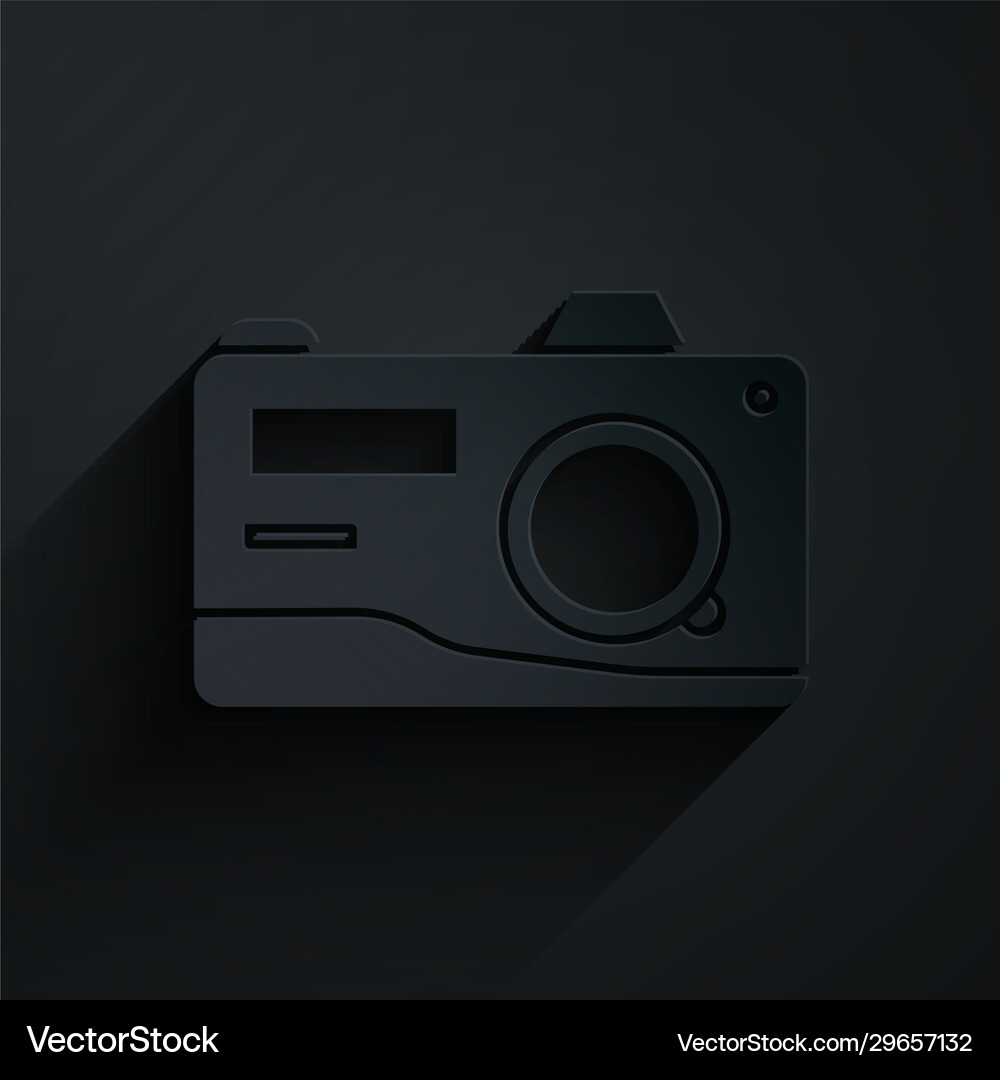 Paper cut photo camera icon isolated on black Vector Image