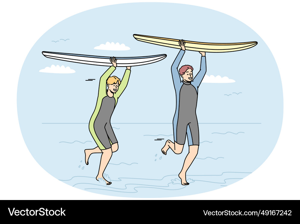 Guys in wetsuits run with surfboards along Vector Image
