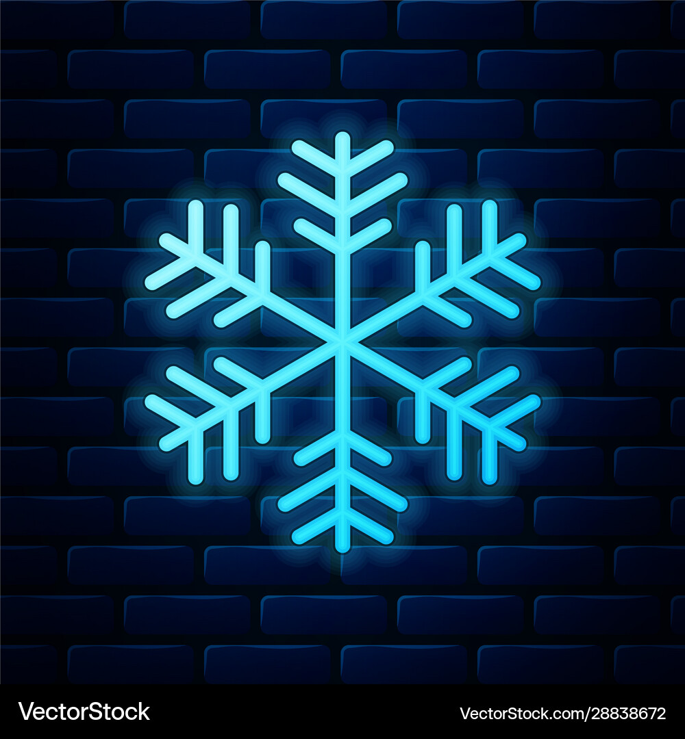 Glowing neon snowflake icon isolated on brick wall