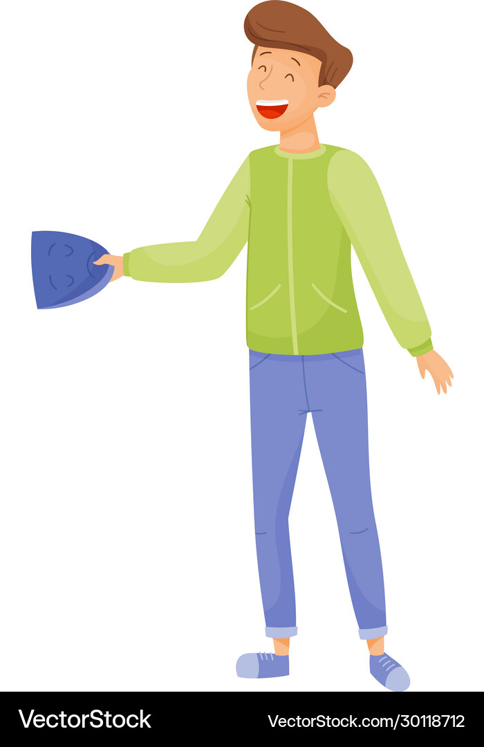 Young smiling man standing and holding mask Vector Image