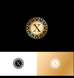 X gold letter with swirly ornaments Royalty Free Vector