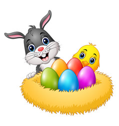 Easter rabbit with chicks and colorful eggs in the